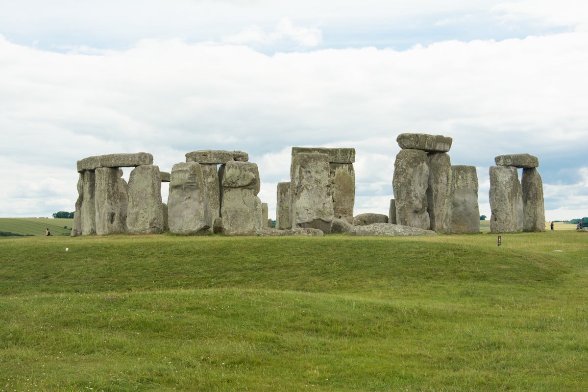 Stonehenge prehistoric monument under dramatic cloudy sky