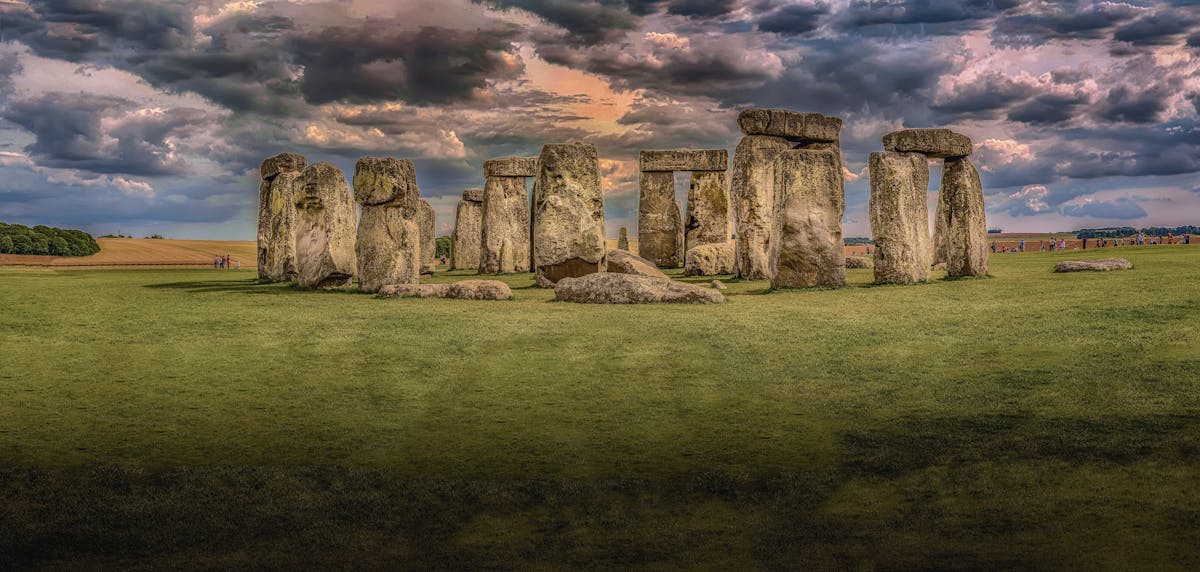 Panoramic photograph of Stonehenge monument with dramatic cloudy sky