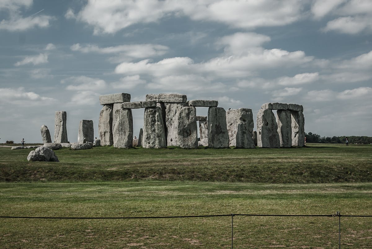 Wide angle view of Stonehenge circle under dramatic clouds