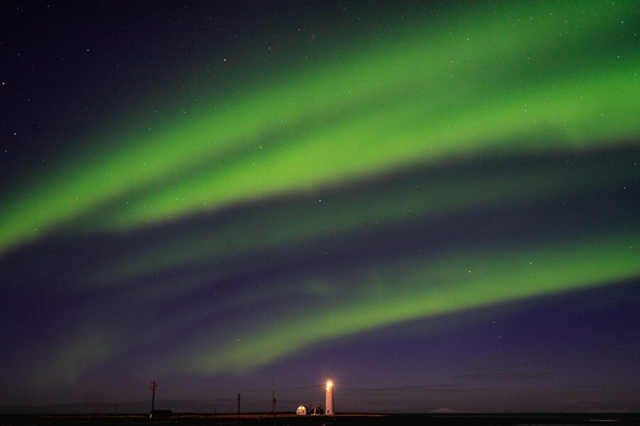 Stunning aurora borealis over GrÃ³tta lighthouse in Seltjarnarnes, Iceland.