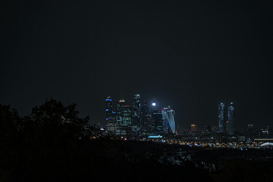 Oslo skyline at dusk with city lights reflecting on water