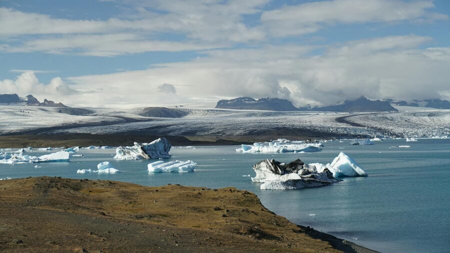 Stunning icebergs floating in Jokulsarlon Glacier Lagoon, capturing the beauty of Iceland's icy land