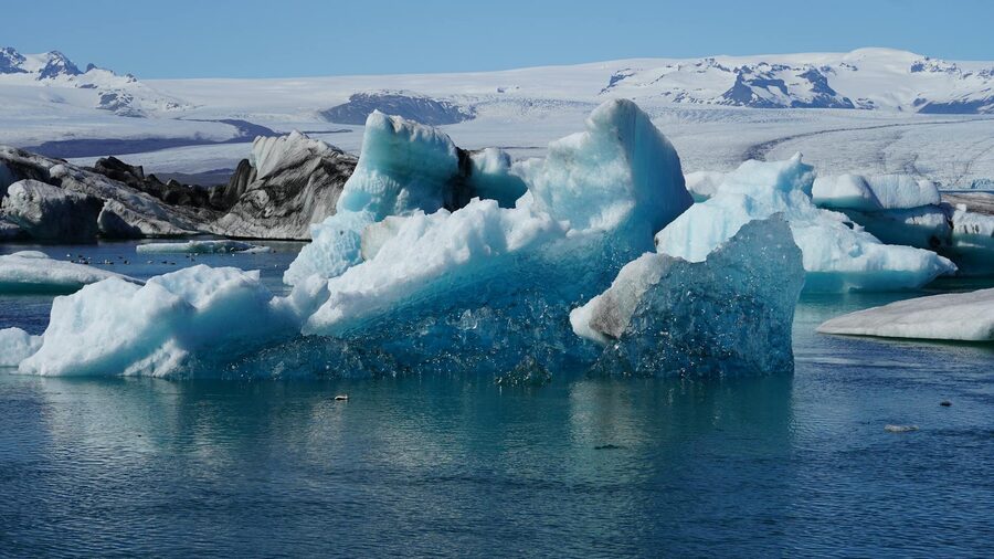 Stunning view of icebergs floating in Jokulsarlon Glacier Lagoon, Iceland, showcasing glacial beauty