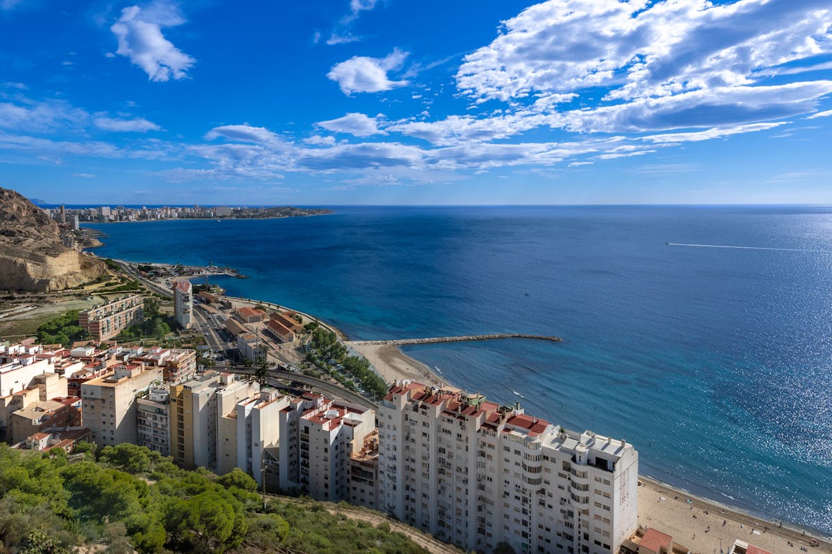 Aerial view of Alicante city coastline and urban skyline on a clear day