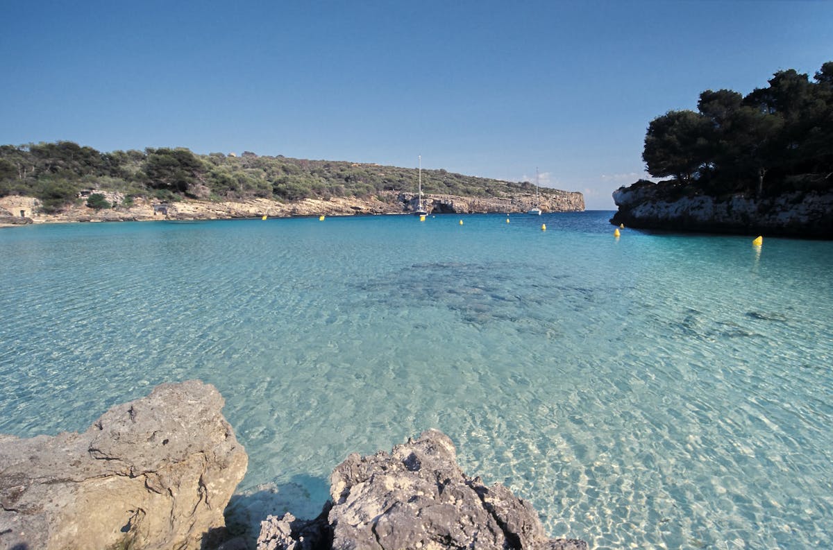 Crystal clear turquoise water in a small Mediterranean cove