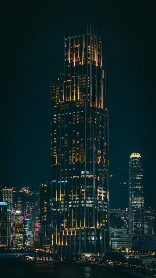 Oslo Opera House illuminated at night with city reflections
