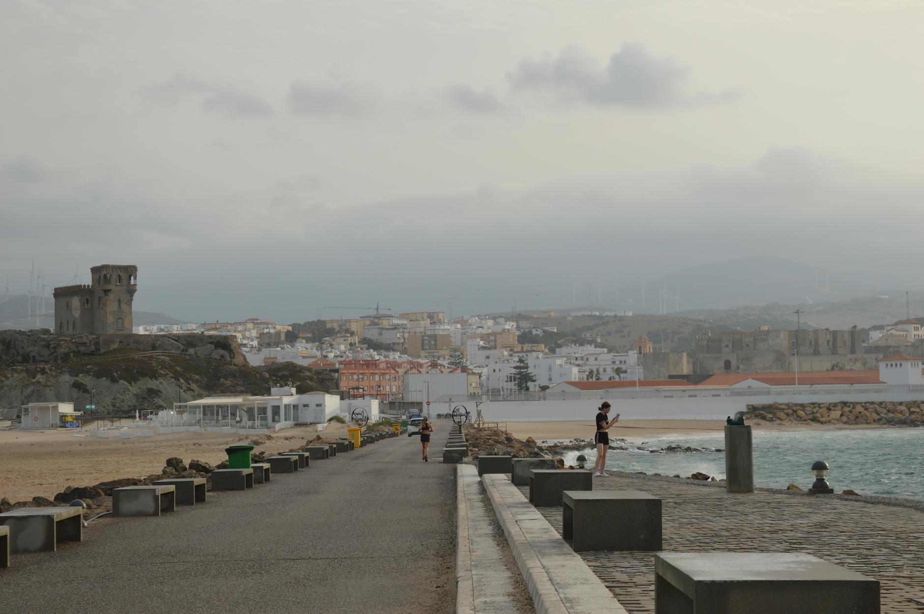 Scenic coastal town view from a seaside pathway in Tarifa