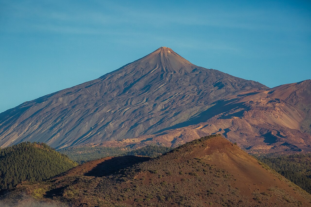 Mount Teide volcano glowing orange at sunset in Tenerife