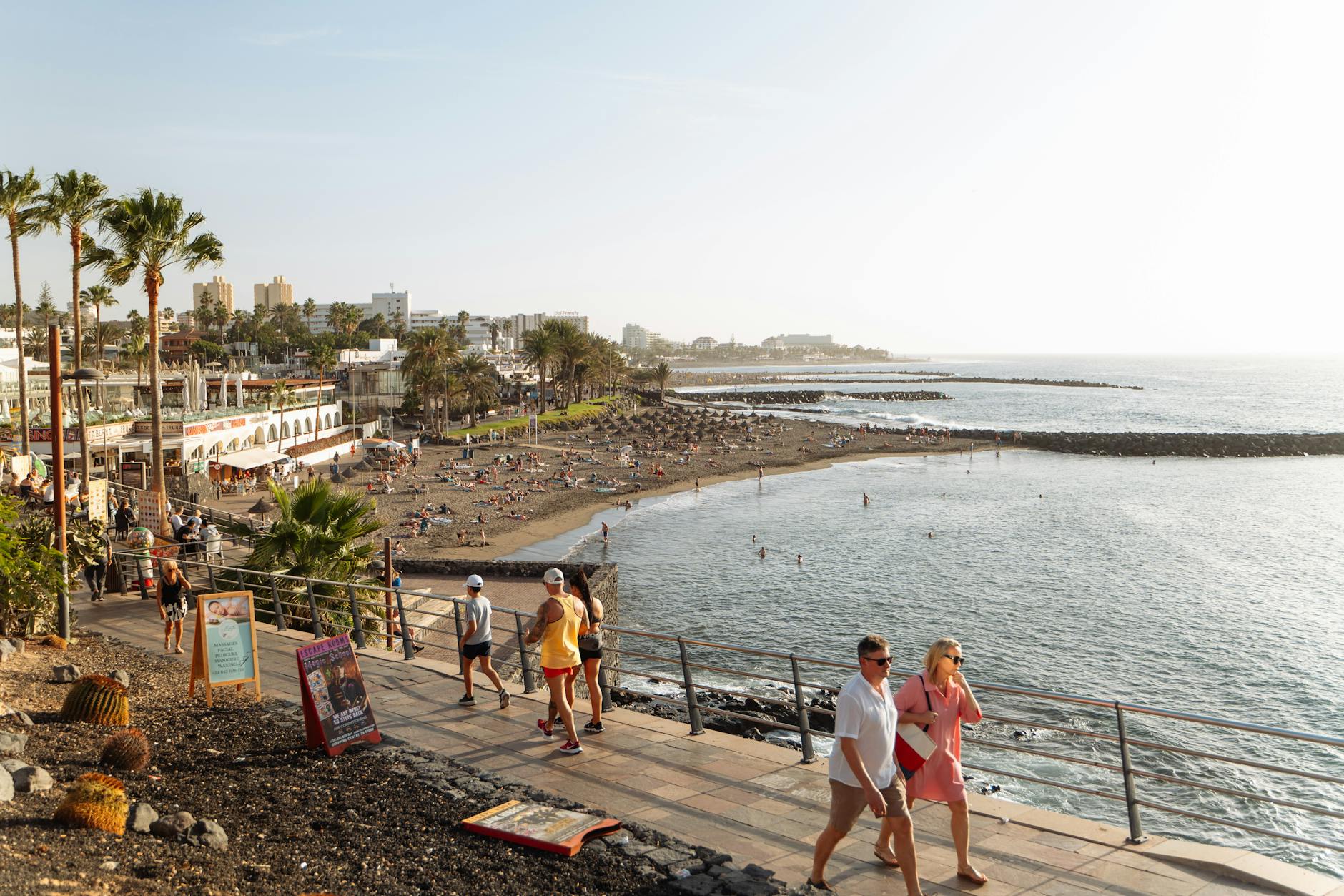 Beachgoers enjoying a sunny day at a Tenerife beach