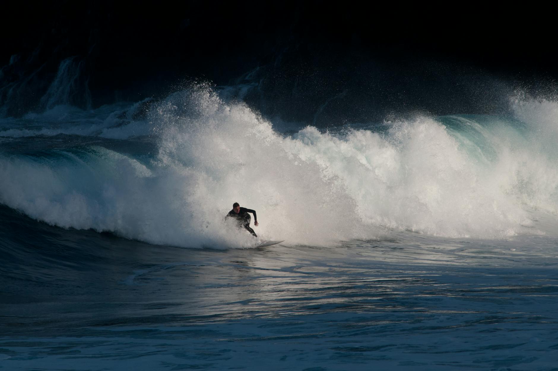 Surfer riding powerful waves in Tenerife