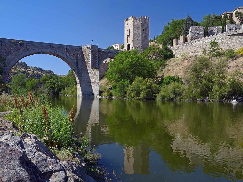 The Alcantara Bridge in Toledo Spain viewed from the northeast with the Alcazar in the background