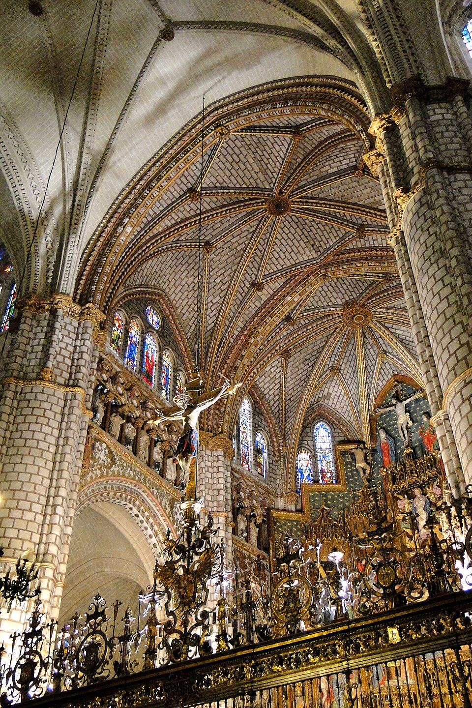 Interior of Toledo Cathedral showing Gothic arches and stained glass windows