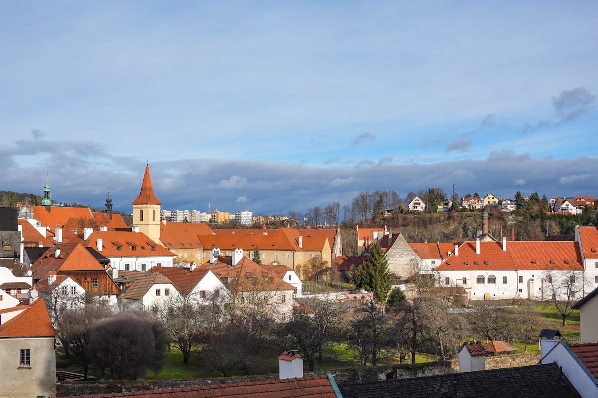 Picturesque view of Cesky Krumlov townscape with red rooftops and historic architecture