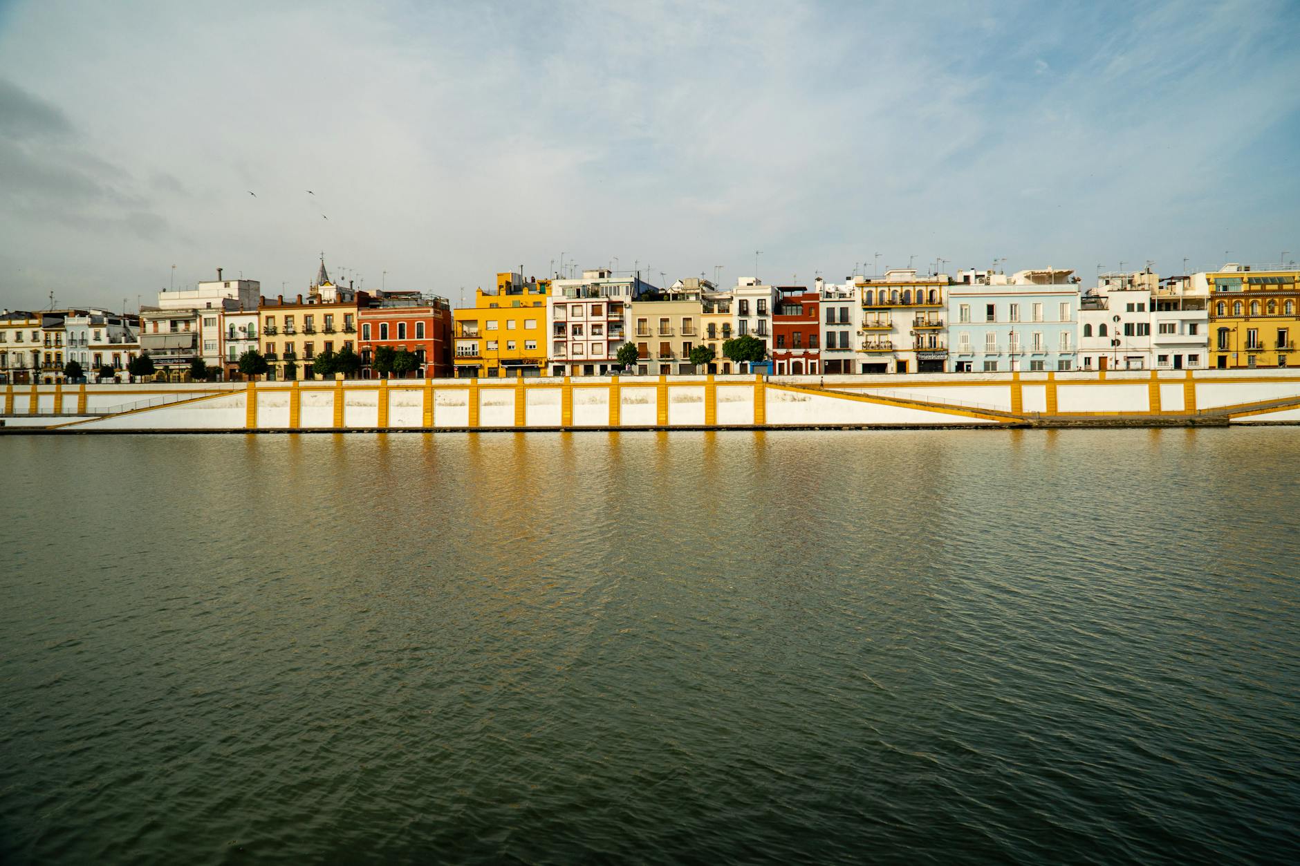 Colorful buildings along the Guadalquivir River in Triana Seville