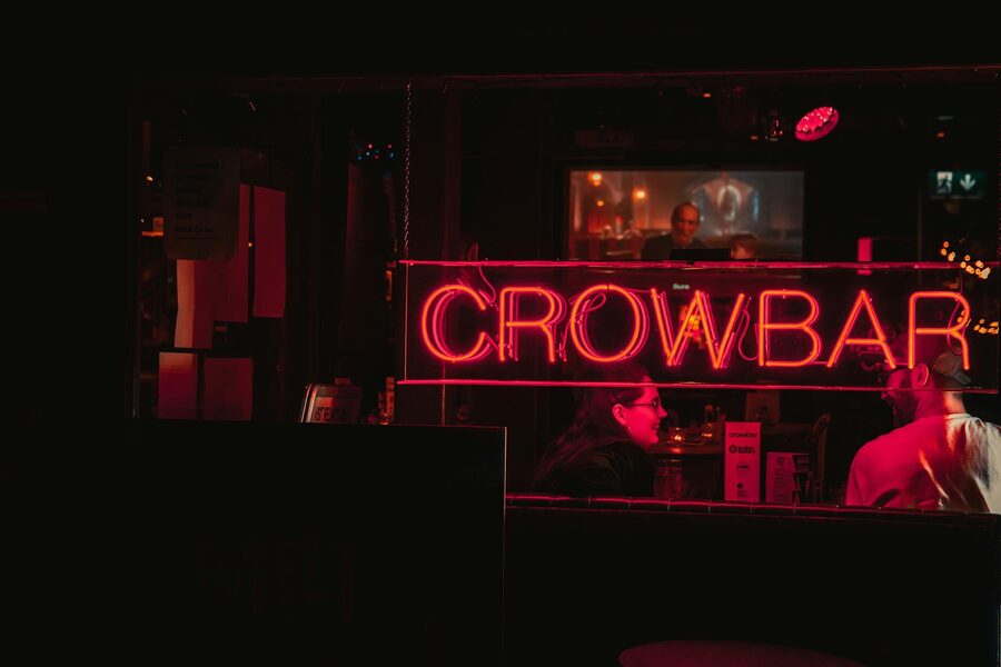 Two people enjoying a lively night at a bar