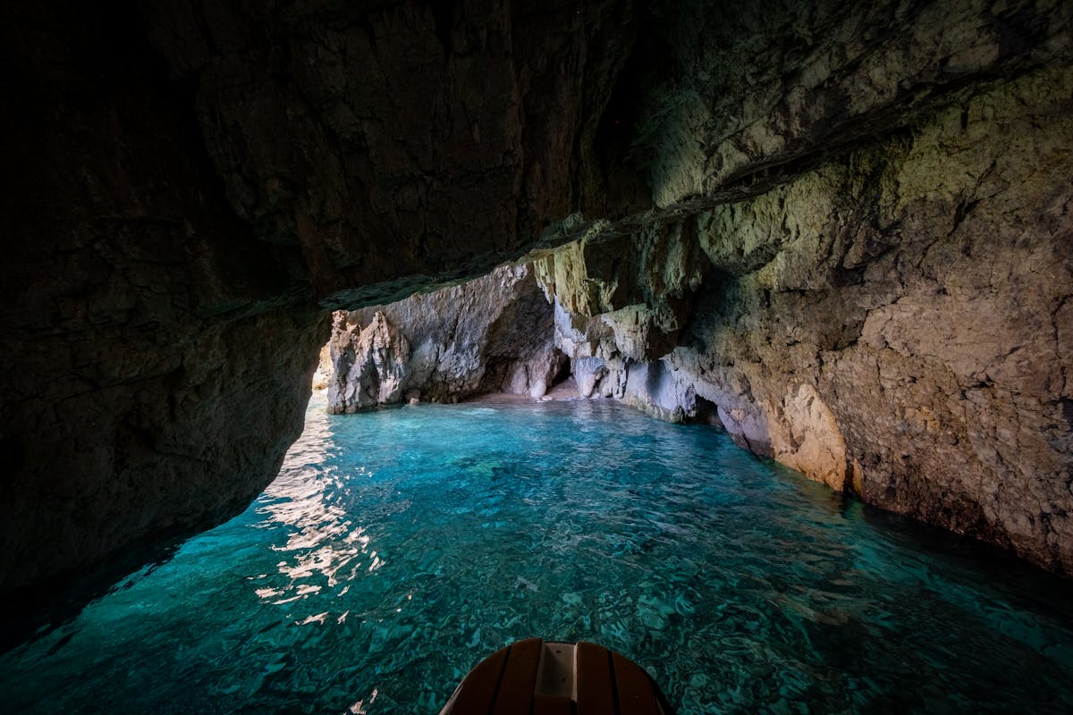 Turquoise water inside an underground cave suitable for boat rides