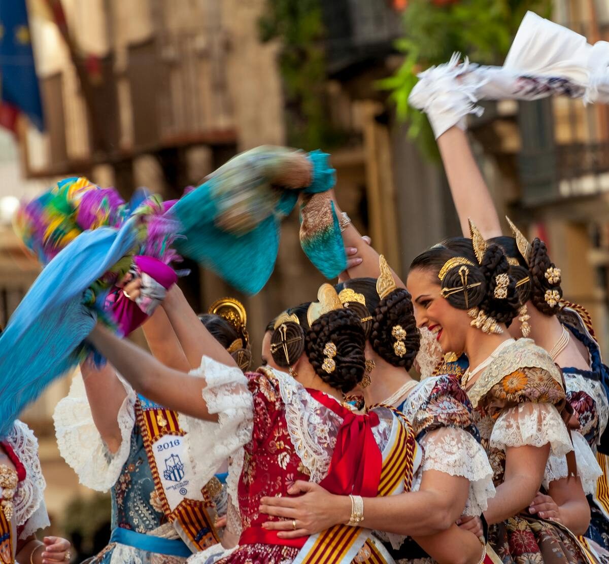 Women wearing traditional Valencian fallera dresses during Las Fallas festival