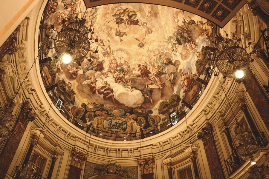 Intricate Renaissance fresco painting inside an ornate dome in Valencia