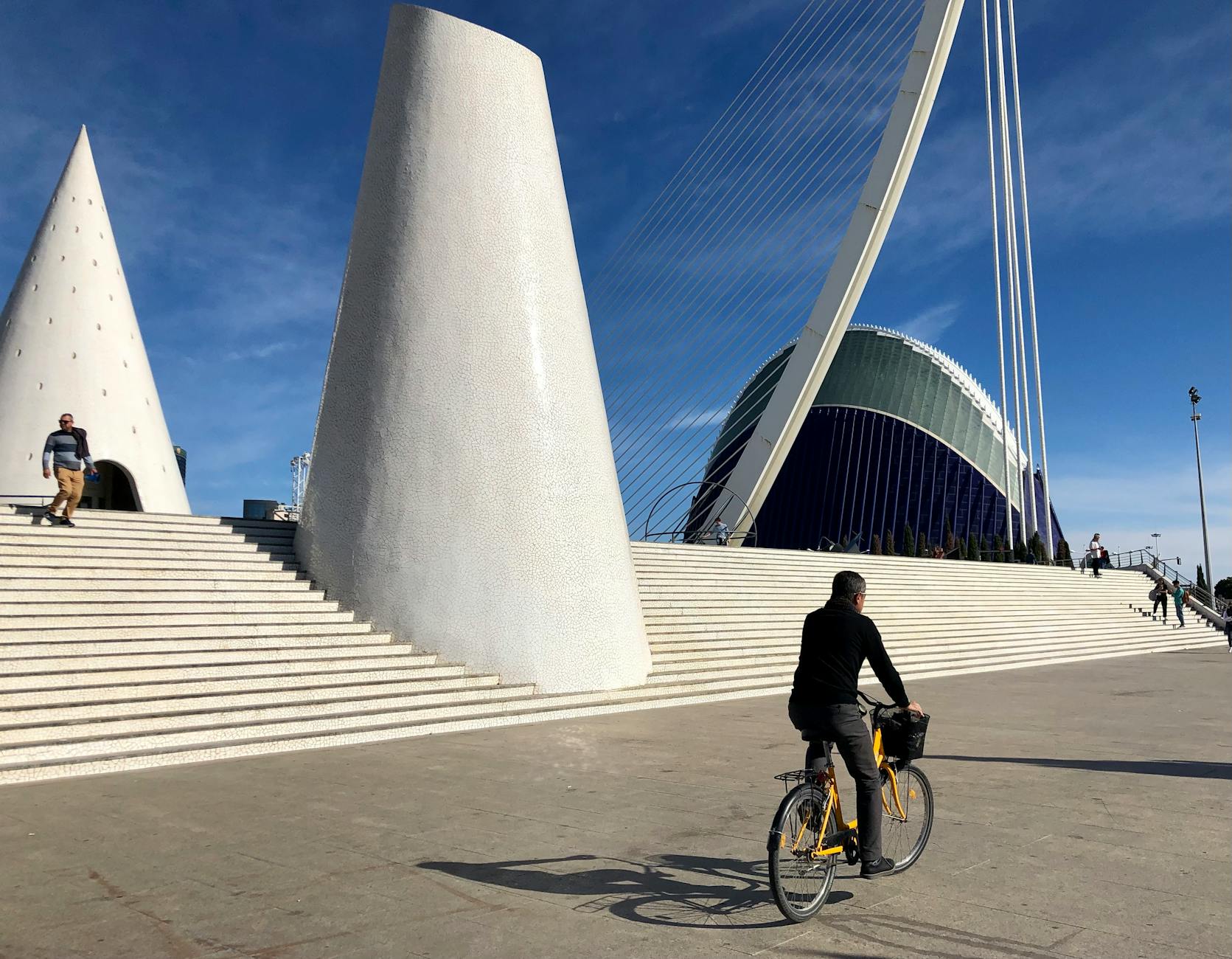 Cyclist rides past the Serreria Bridge in Valencia, Spain