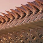 The futuristic City of Arts and Sciences complex in Valencia at sunset with reflecting pools