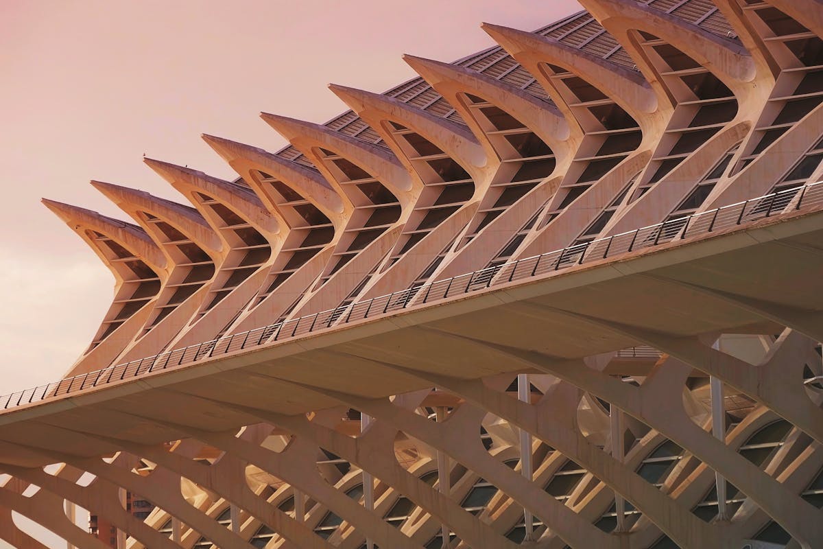 The futuristic City of Arts and Sciences complex in Valencia at sunset with reflecting pools