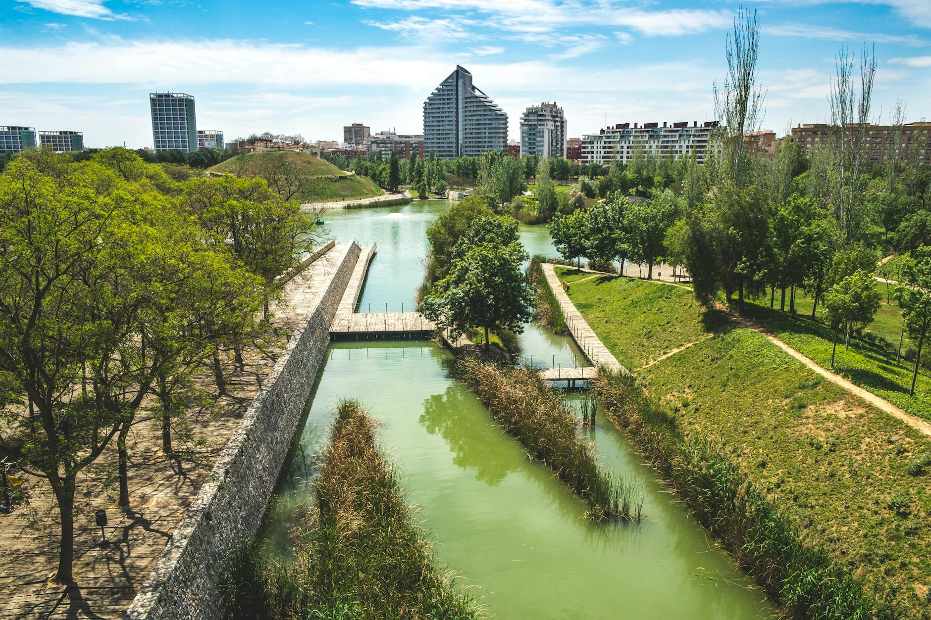 Aerial view of Turia Gardens with modern buildings in Valencia, Spain