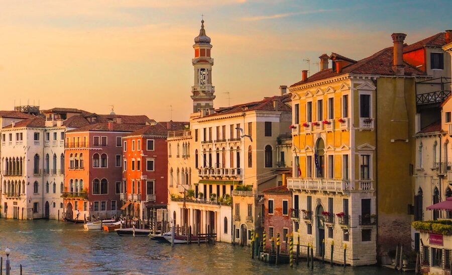 Warm sunset light illuminating Venice canal architecture