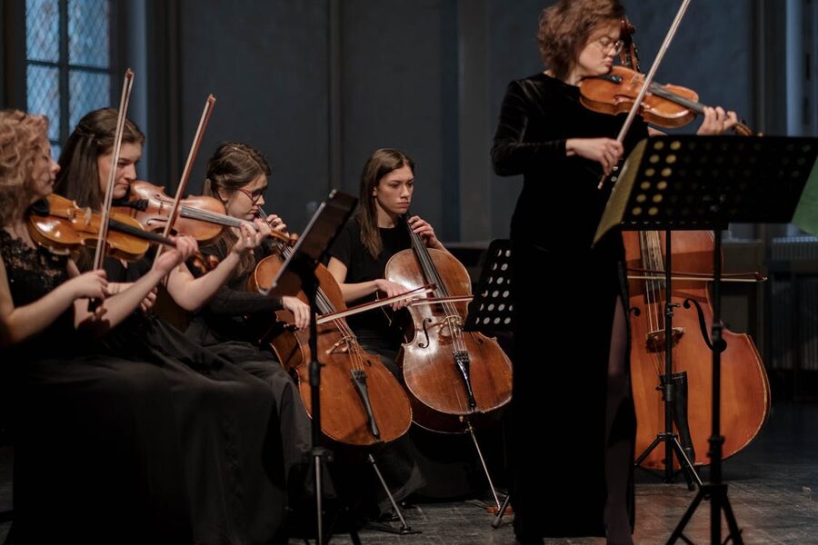String ensemble performing classical music in an ornate church setting