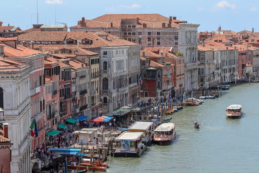An aerial view showing the Grand Canal winding through Venice with historic buildings on both sides