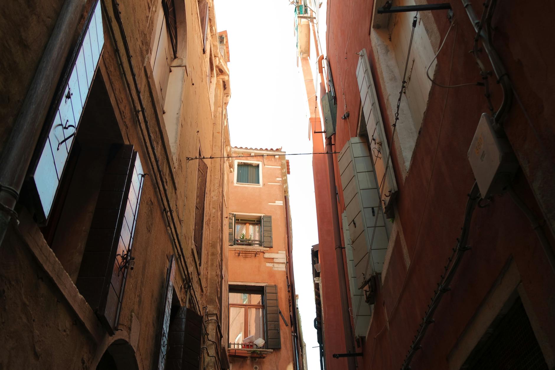 A narrow alley in Venice showcasing historic architecture