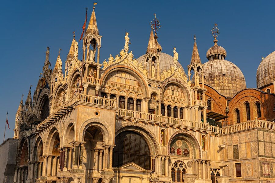 St Marks Basilica and bell tower illuminated at sunset in Venice Italy