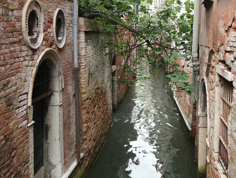 Serene Venice canal surrounded by ancient brick architecture