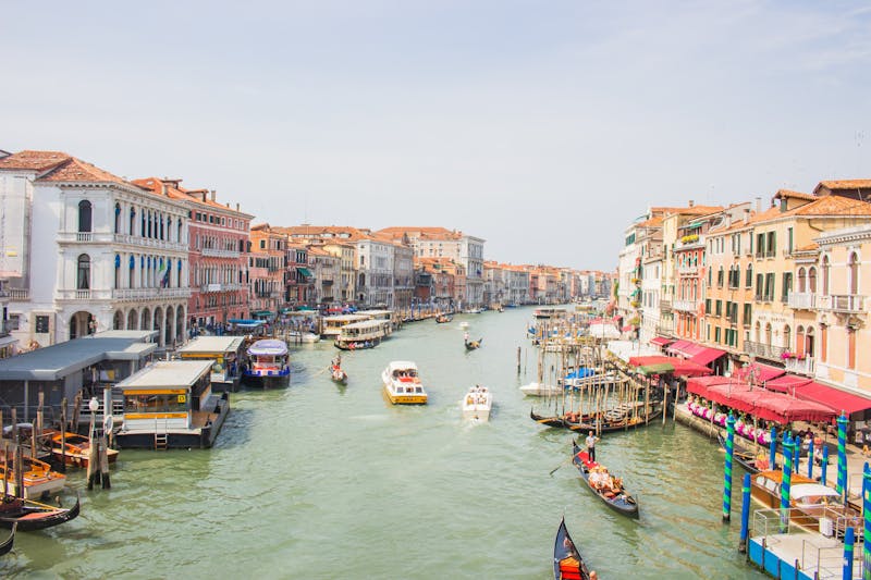 Grand Canal in Venice with gondolas, boats and historic architecture