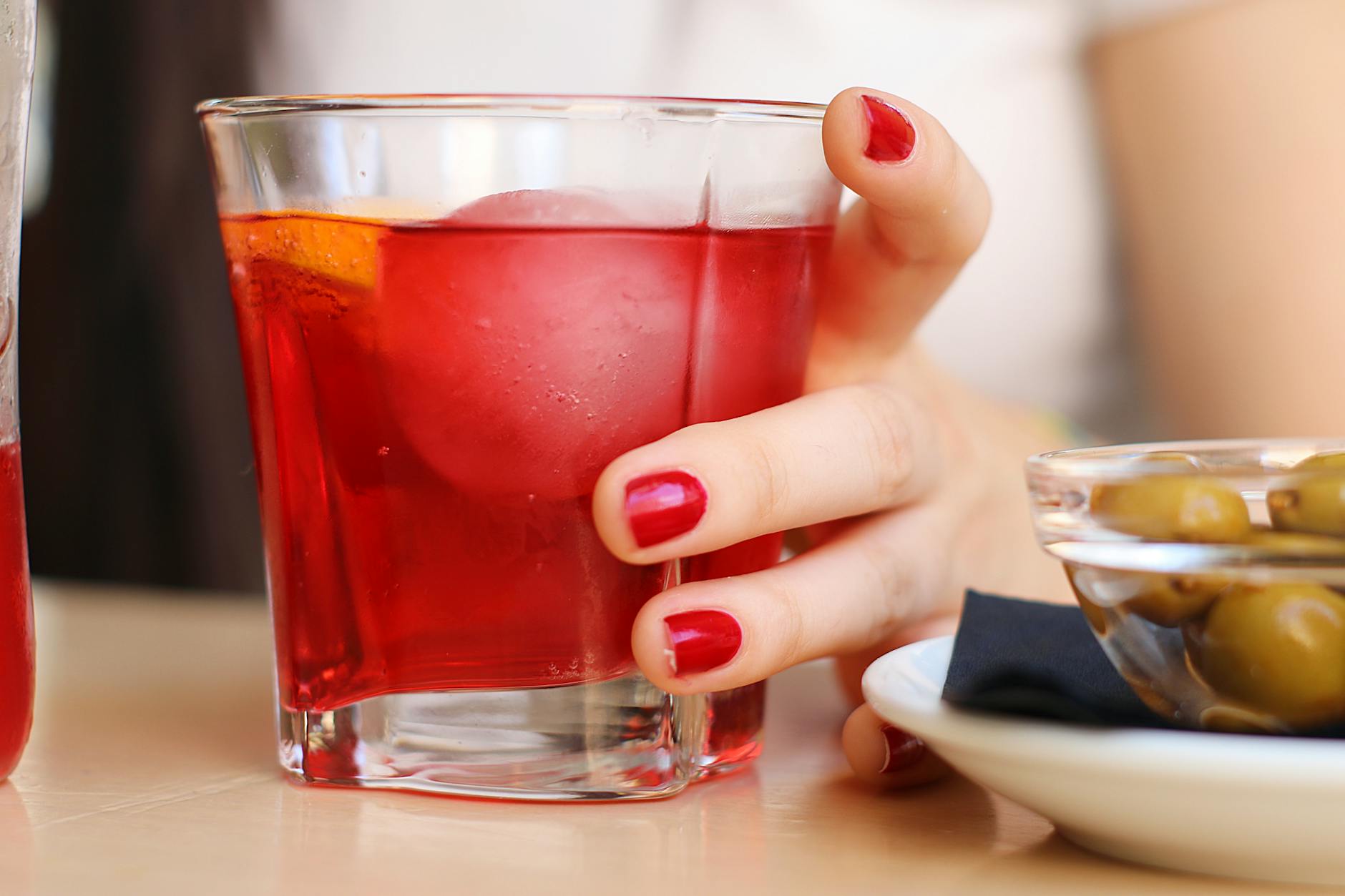 Red vermouth cocktail with olives at a Madrid bar