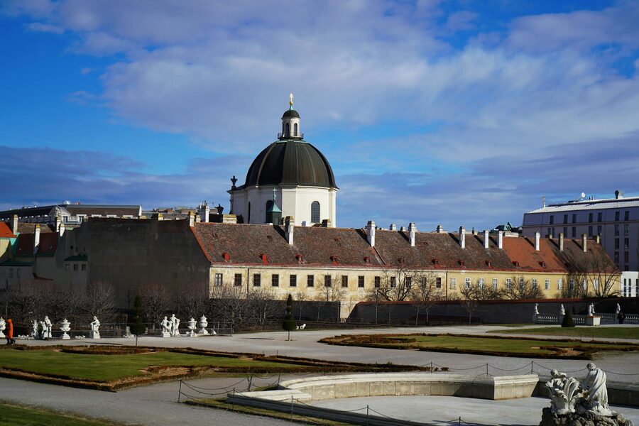 Stunning view of a historic church dome in Vienna with clear blue skies.