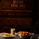 Viking-themed medieval feast table with rustic dishes and traditional decor