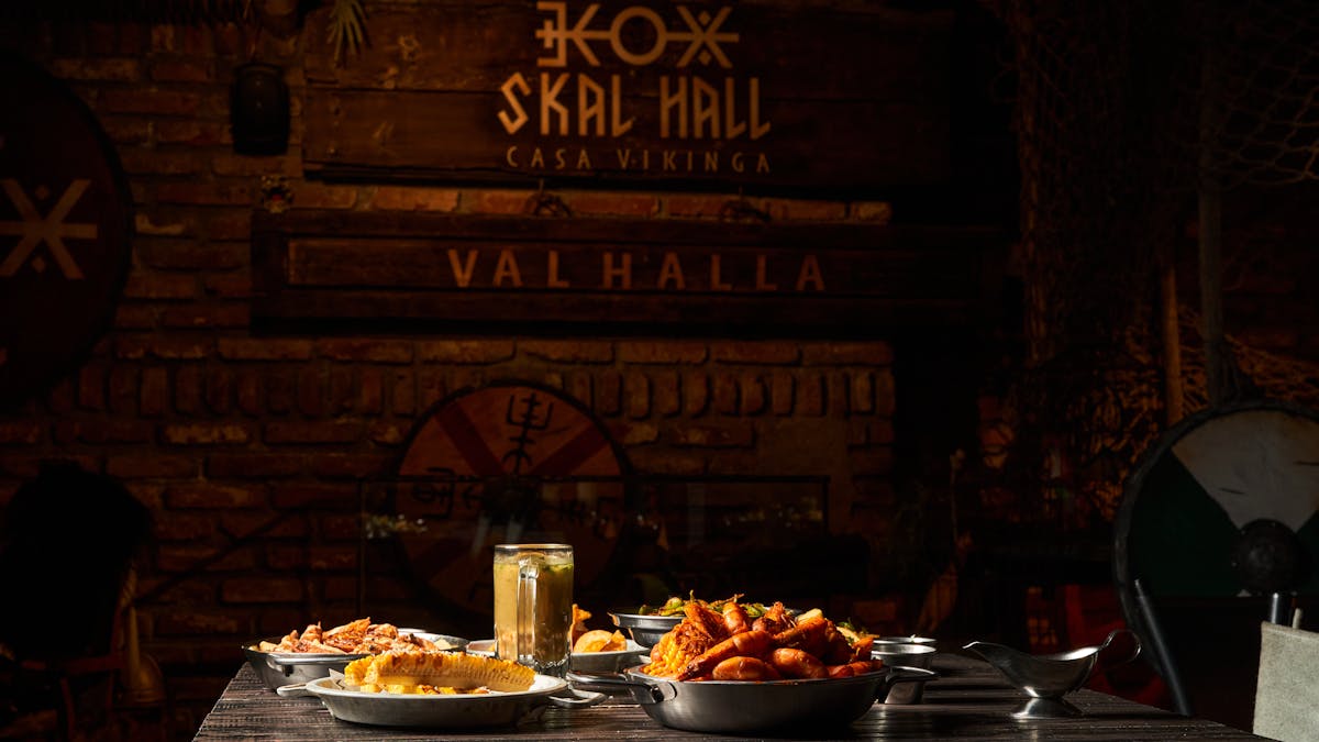 Viking-themed medieval feast table with rustic dishes and traditional decor