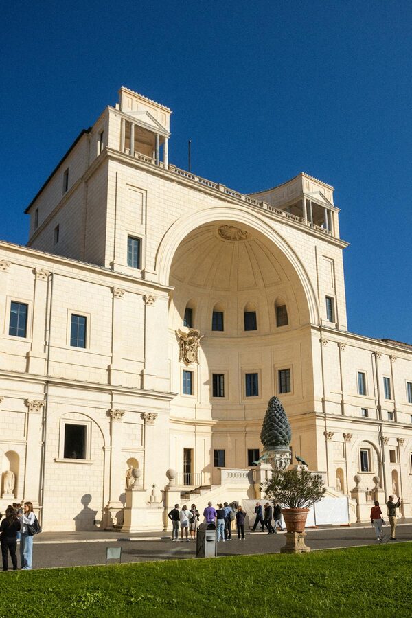 Visitors admiring the Villa Borghese architecture on a sunny day in Rome