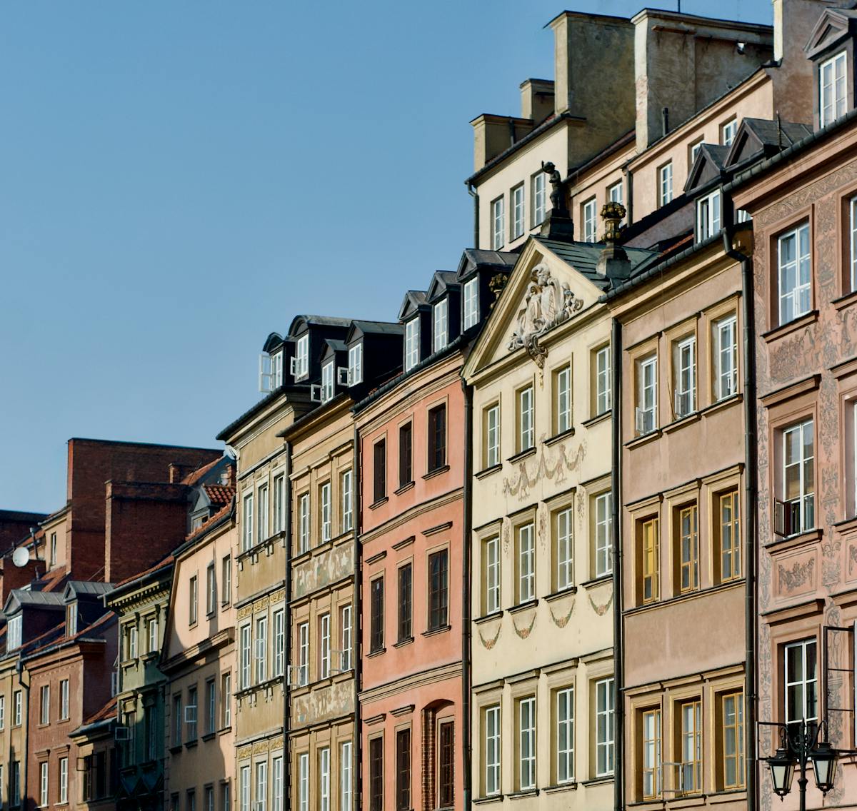 Colorful historic houses in Warsaw Old Town on sunny day