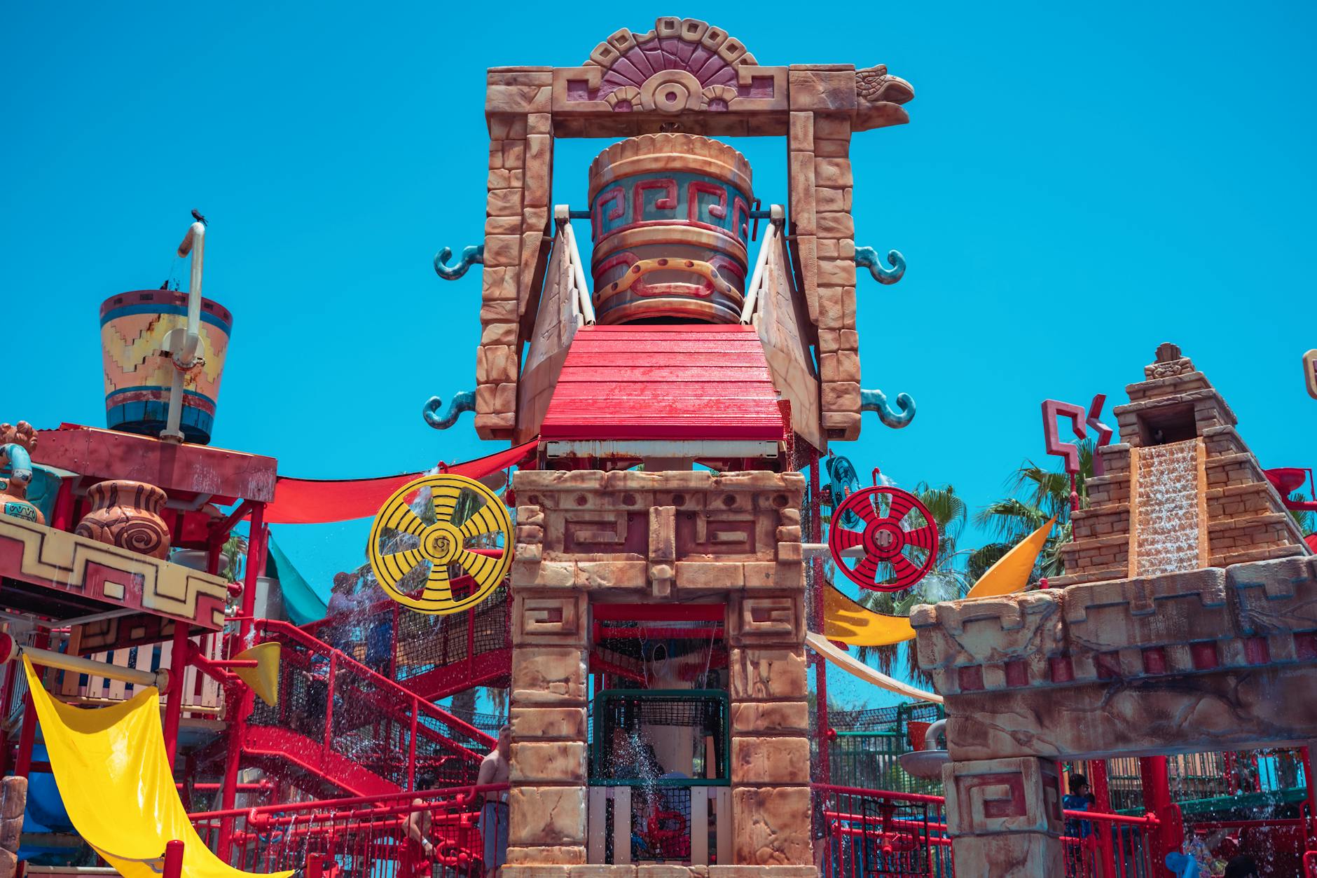Water park with themed structures under blue sky