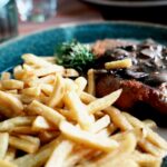 Appetizing Wiener Schnitzel plated with sauce