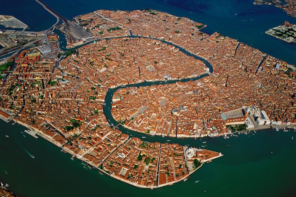 Aerial view of Venice old town and lagoon showing the island city surrounded by water