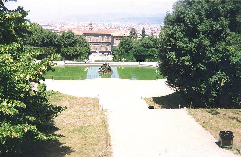 View from the upper Boboli Gardens looking back down towards Palazzo Pitti through trees and pathways