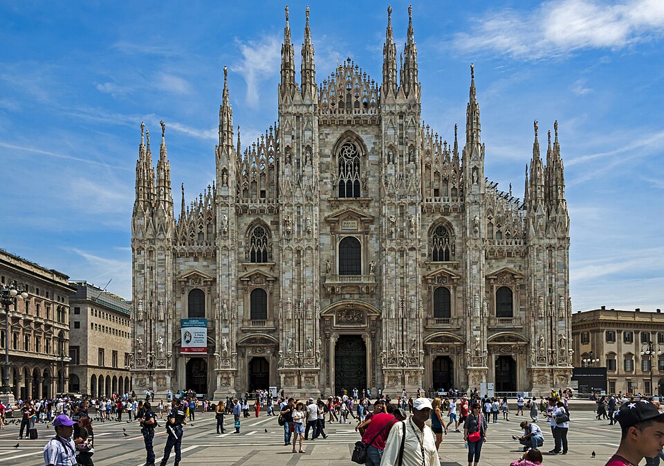 Milan Cathedral with travelers walking in Piazza del Duomo