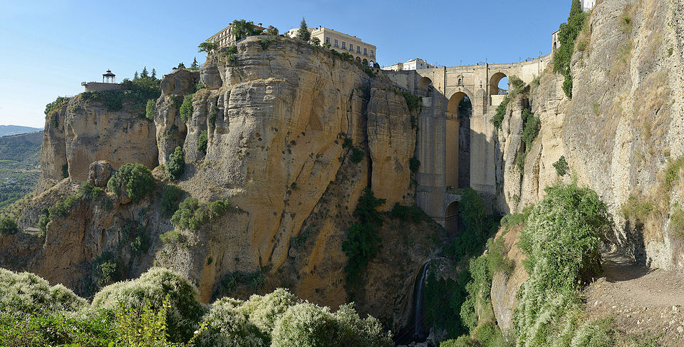 The Puente Nuevo bridge viewed from below showing massive stone arches spanning El Tajo Gorge