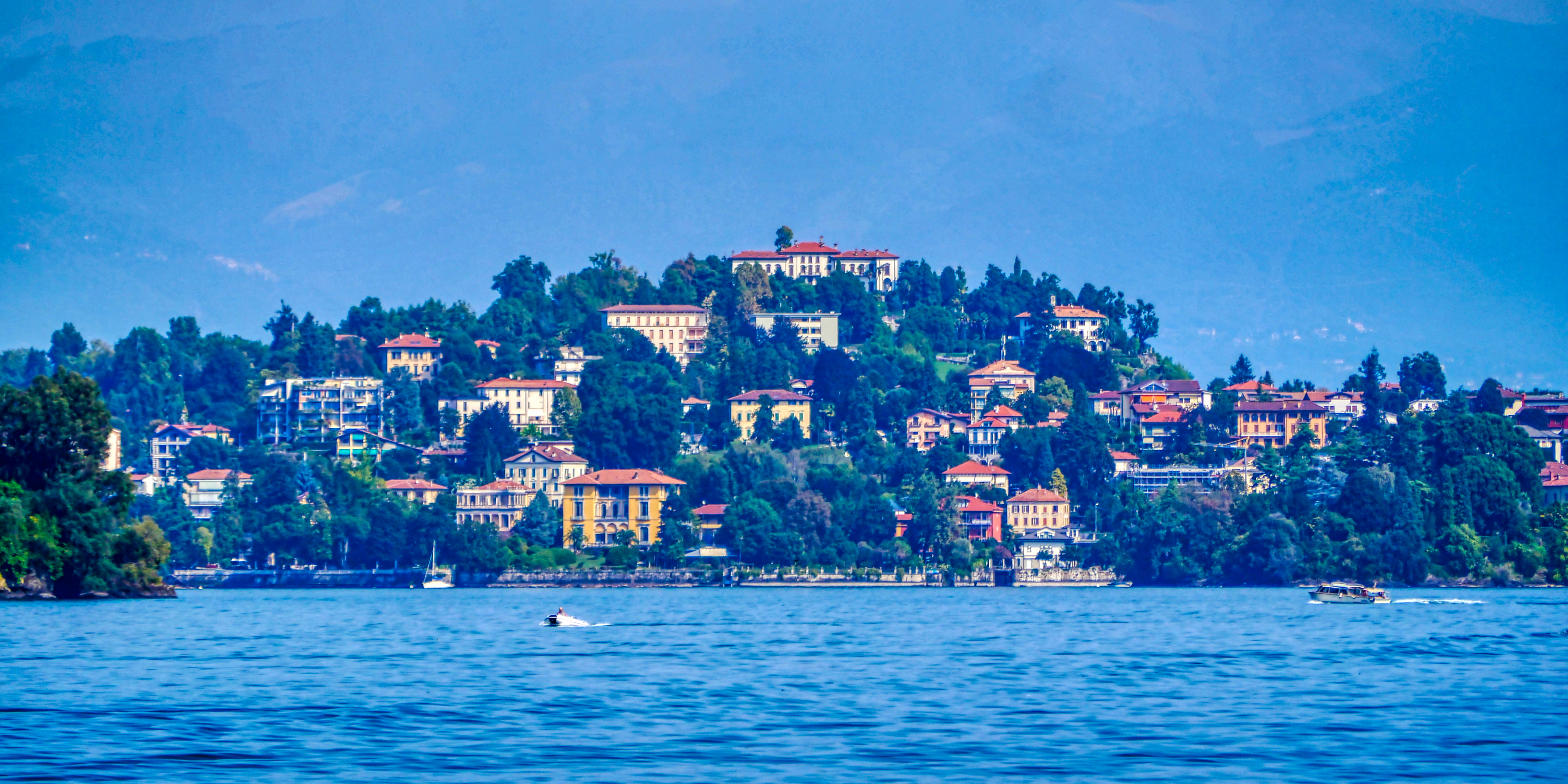 Panoramic view of Lake Maggiore from the town of Stresa with boats and mountains