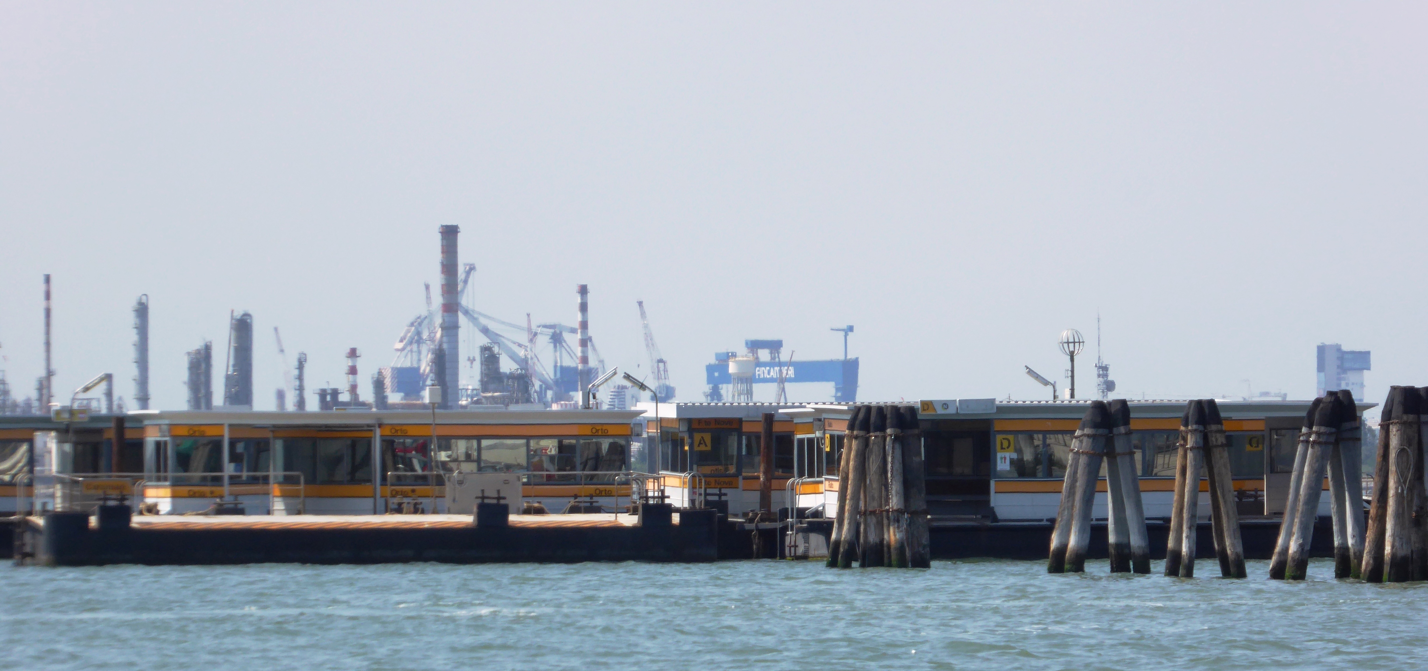Vaporetto water bus stops and docked boats in Venice canal