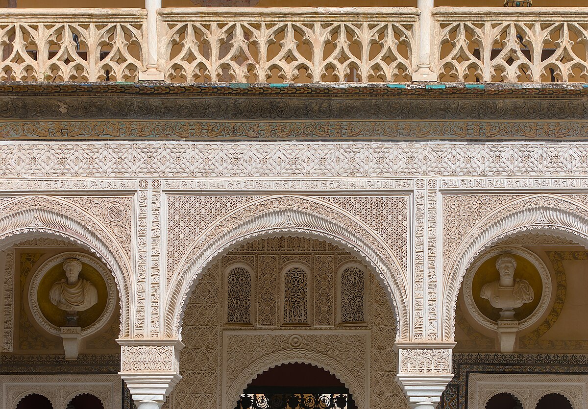 Courtyard of Casa de Pilatos palace in Seville with fountain and arches