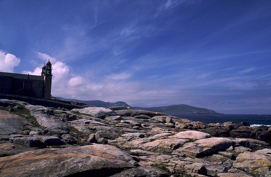 The Sanctuary of Virxe da Barca in Muxia perched on the rocky Atlantic shore
