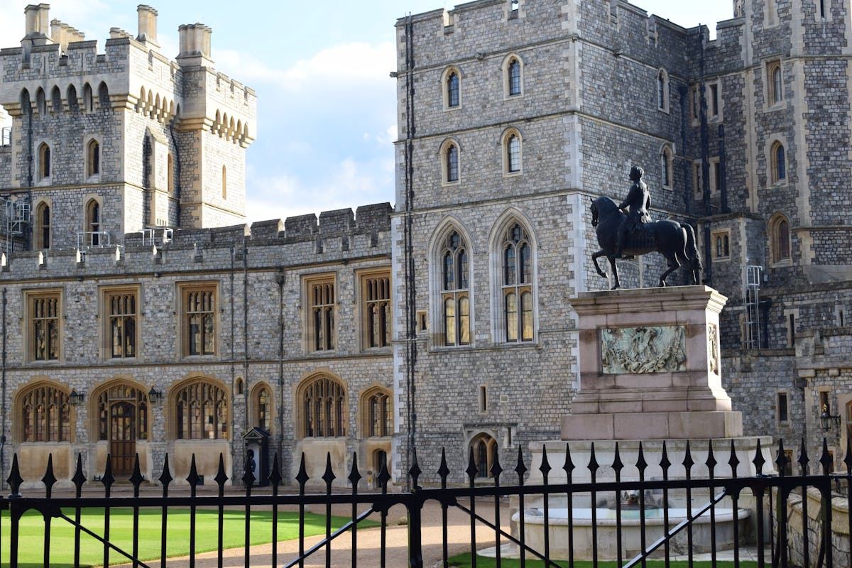 Windsor Castle Gothic architecture with equestrian statue in foreground